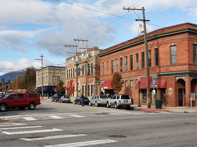 Red awnings welcome visitors to Sandpoint's Main Street, where "running errands" means catching up with half the town.
