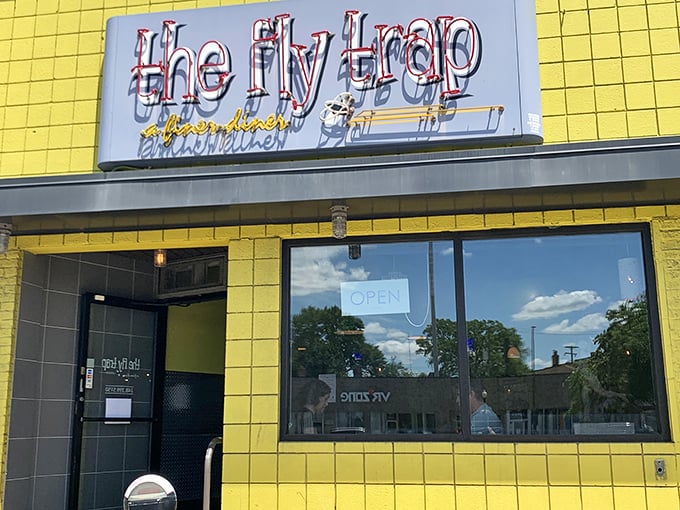 That neon sign against bright yellow brick? The Fly Trap doesn't just serve breakfast&mdash;it announces it like a delicious morning fanfare.