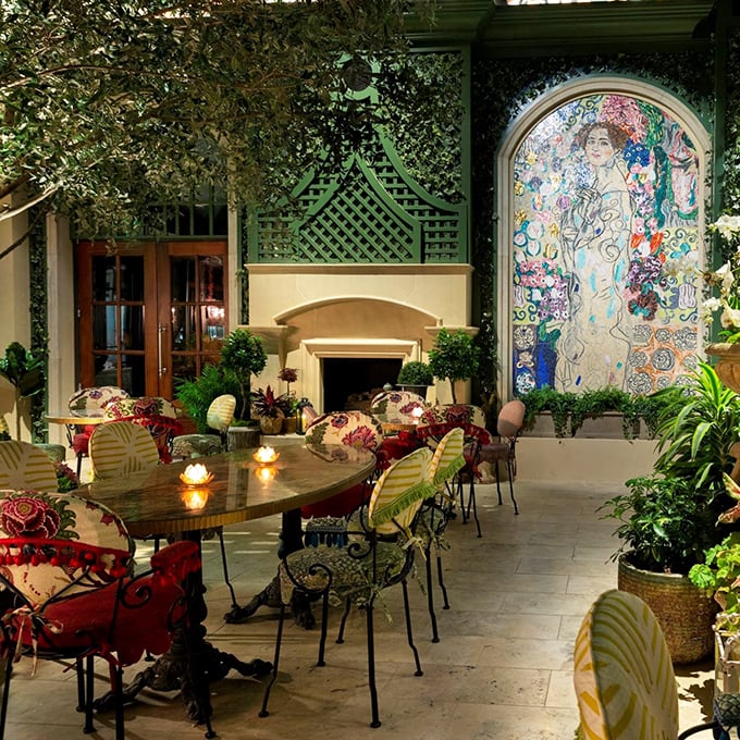 Dining under a canopy of greenery with art that pops. Like having dinner in Monet's garden, but with better lighting and no mosquitoes.