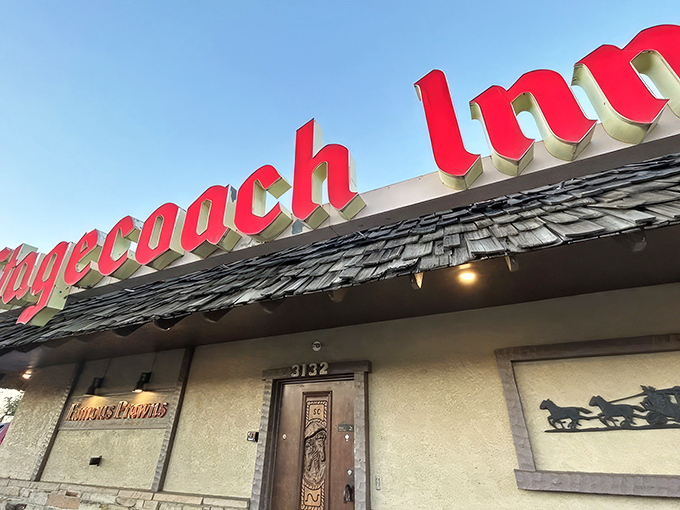 Twilight transforms the Stagecoach Inn into a beacon for beef lovers. That wooden-shingled roof has sheltered happy diners for generations.