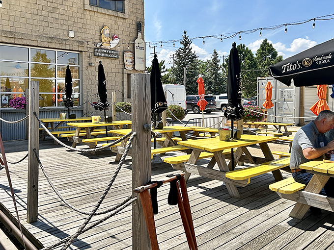 The deck at Twisted Fisherman feels like summer camp for grown-ups. Those yellow tables practically shout "Sit here and stay awhile!"