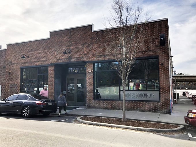 Brick, glass, and donuts &ndash; Vortex's storefront promises artisanal delights inside this revitalized Asheville landmark.