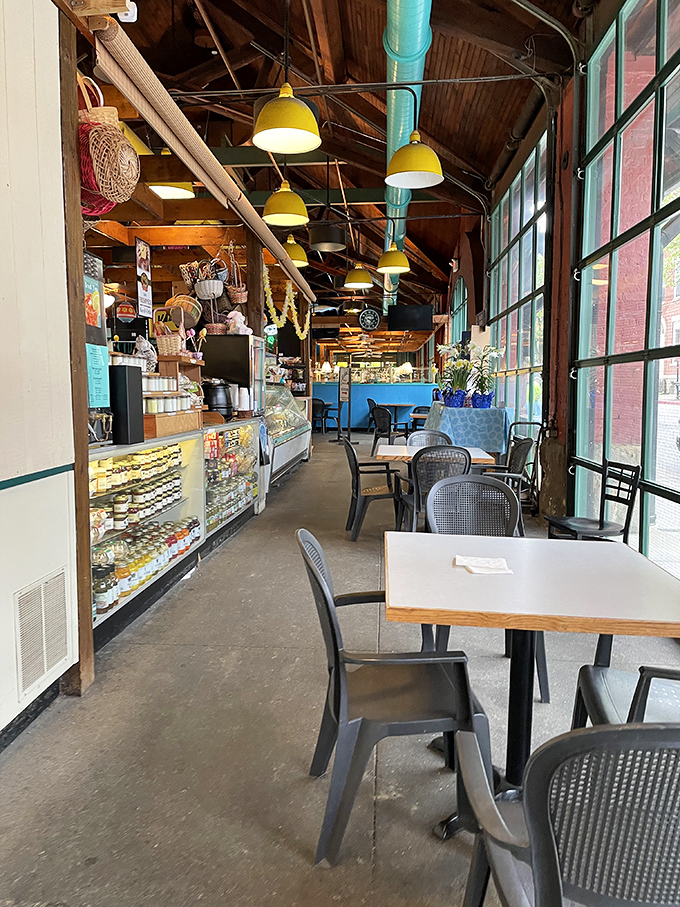 Yellow pendant lights dangle like fishing lures above simple tables. This no-frills interior says, "We're too busy perfecting fish to worry about fancy decor."
