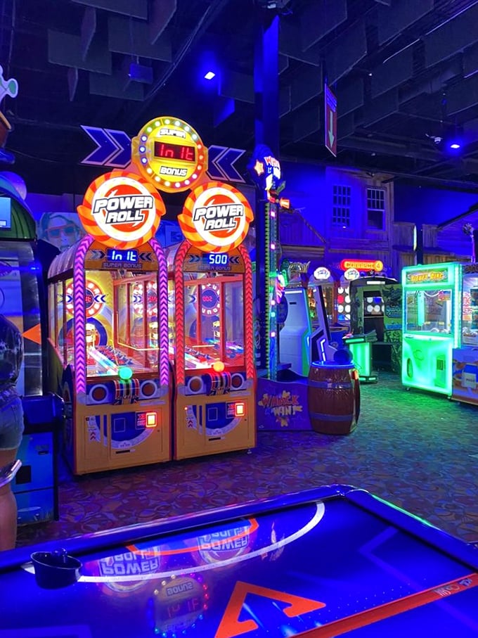 Neon dreams come alive in the arcade where Power Roll machines stand like glowing sentinels, beckoning players with the siren song of potential jackpots.