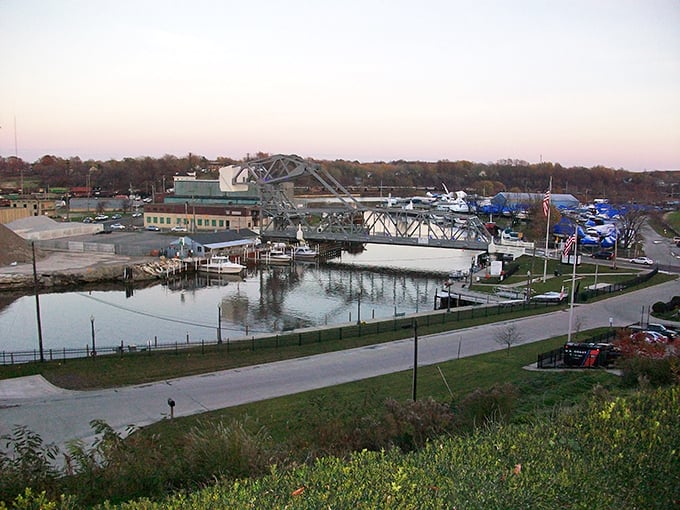 The iconic Ashtabula Lift Bridge rises like a mechanical ballet performer, connecting the harbor district to downtown while providing passage for boats below.
