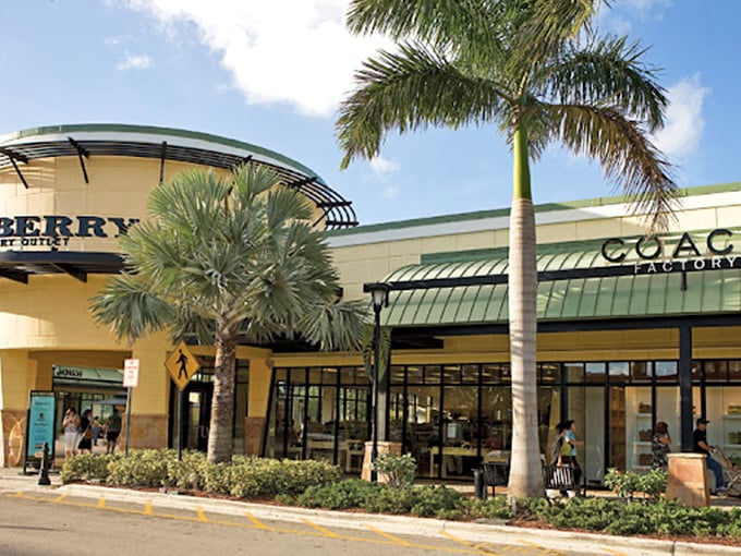 Burberry and Coach sitting side by side&mdash;like finding two Broadway stars sharing a dressing room, but with better handbags and Florida sunshine.