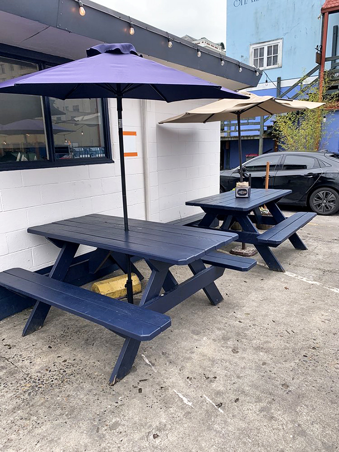 Navy blue picnic tables under purple umbrellas – the perfect throne from which to enjoy your frozen royal decree.