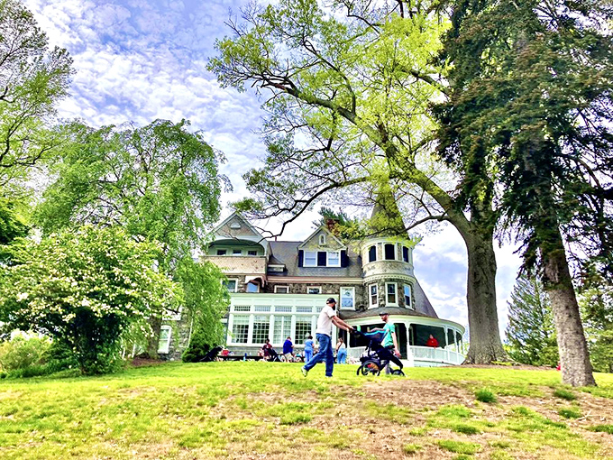 Stately trees frame this architectural masterpiece where steam-powered dreams and mechanical marvels await curious visitors of all ages.