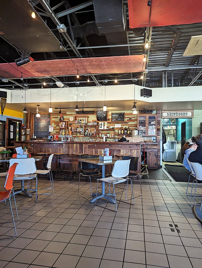 Inside, the industrial-chic ceiling meets warm wooden bar in perfect harmony &ndash; like a coffee-scented hug for weary breakfast seekers.