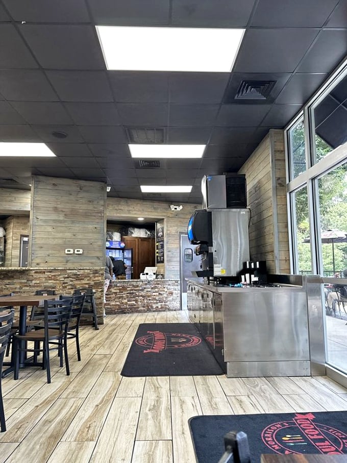 Rustic wood paneling and stone accents create a warm, unpretentious atmosphere where the food rightfully takes center stage.