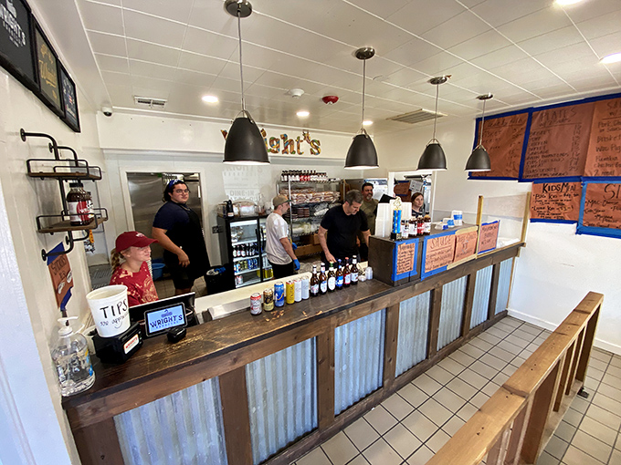 Behind this rustic-industrial counter, barbecue magic happens daily. The corrugated metal and wood speak the universal language of "serious meat ahead."