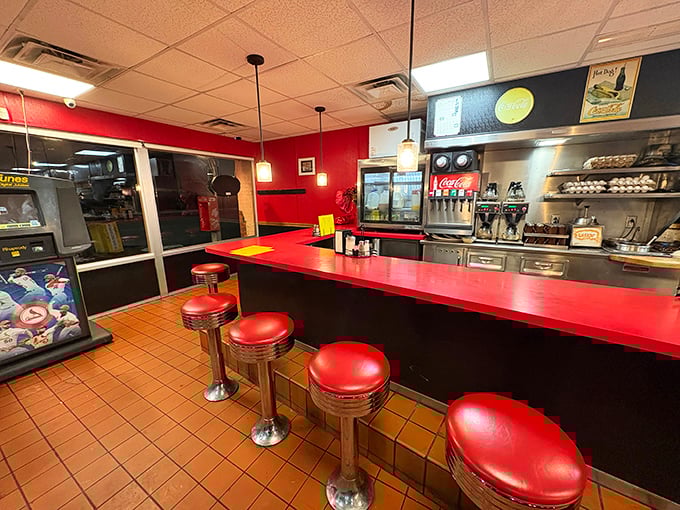 Classic red counter stools invite you to spin once (you know you want to) before settling in for breakfast magic at this quintessential American diner.