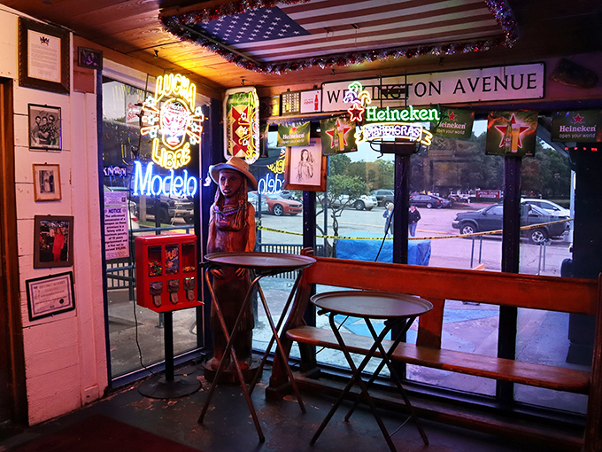 Step inside and you're transported to neon-lit nostalgia. Beer signs glow like beacons, promising cold refreshment to accompany your seafood feast.