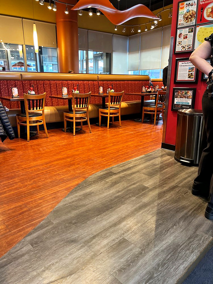 Warm oranges and reds envelop you like a breakfast hug. These booths have witnessed more food epiphanies than a cooking show judge.