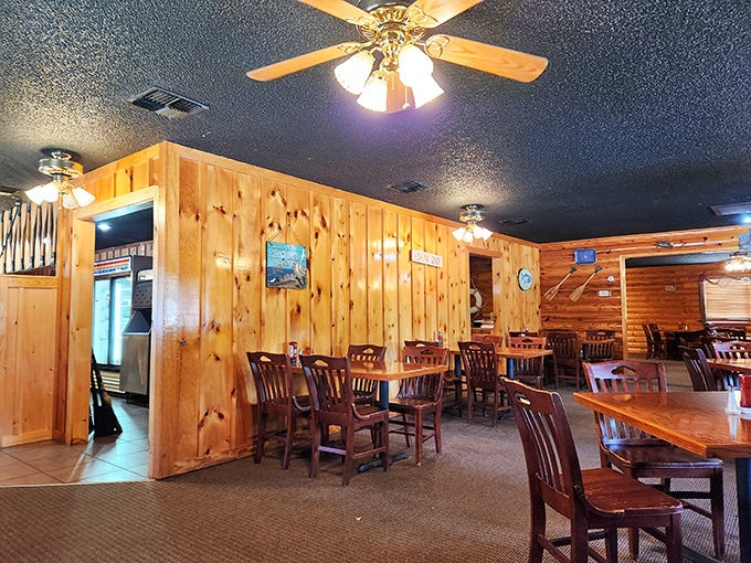 Step inside and you're transported to a cozy cabin retreat where wood-paneled walls whisper promises of comfort food that'll hug your soul.