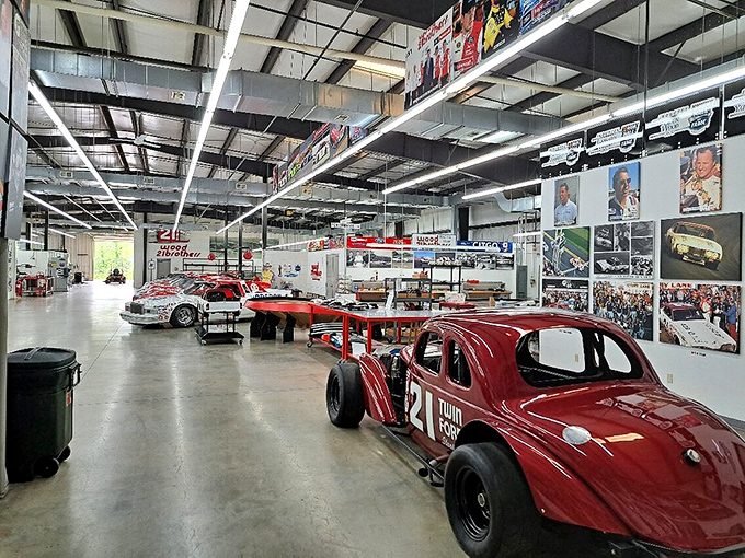 History lines these walls in a gleaming cathedral of speed. That sound you hear? It's decades of racing stories whispering from every corner.