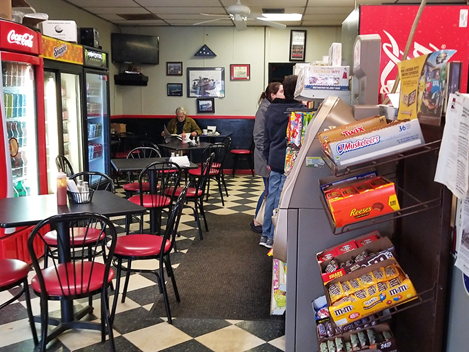 Classic black and white checkerboard floors set the stage for breakfast drama, where regulars and newcomers alike await their starring roles.