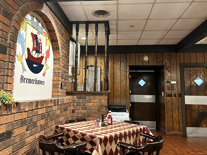 Classic red-and-white checkered tablecloths and exposed brick walls create that "Oma's dining room" feeling that no corporate restaurant could ever replicate.