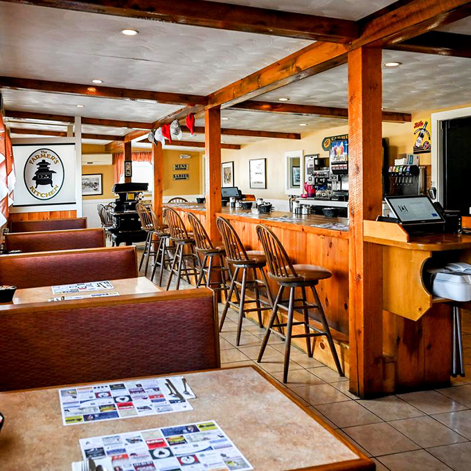 Warm wooden beams and counter seating create that "everybody knows your name" atmosphere where breakfast decisions become life's most important morning task.