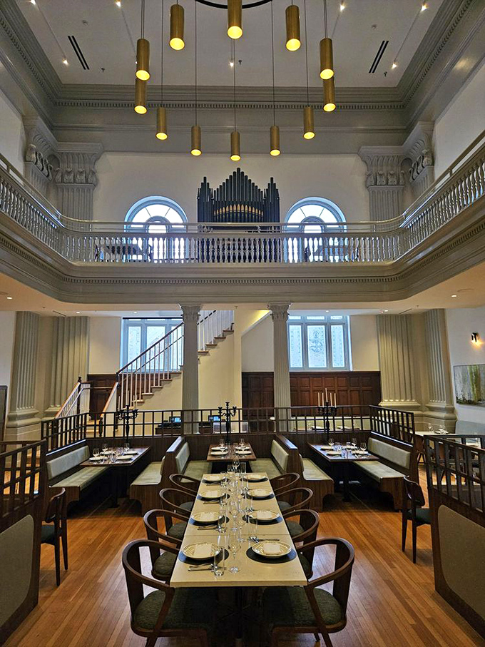 Soaring ceilings, elegant columns, and that magnificent organ loft transform dinner into a cathedral-like experience. Eating here feels downright spiritual.