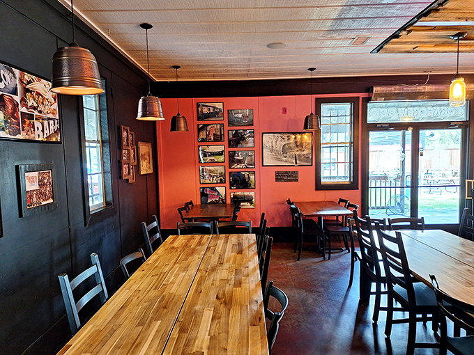 Where barbecue dreams come true. The warm wood tables and coral accent wall create the perfect backdrop for the meat-centric masterpieces about to grace your plate.