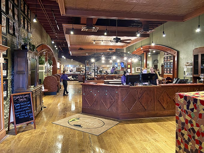 Step inside to warm wooden floors, exposed brick, and a reception area that feels like coming home. The pressed tin ceiling whispers stories of meals past.