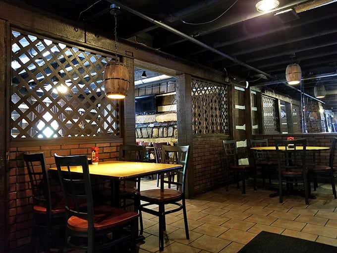 Wooden lattice dividers and barrel light fixtures create intimate dining nooks that feel like you've stumbled into someone's cherished family cabin. 