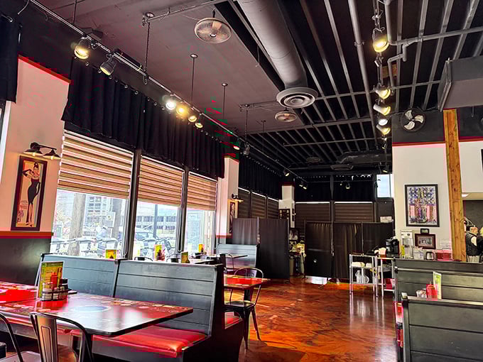 The diner's modern interior marries sleek design with classic comfort – those red booths practically beg you to slide in for a leisurely meal.