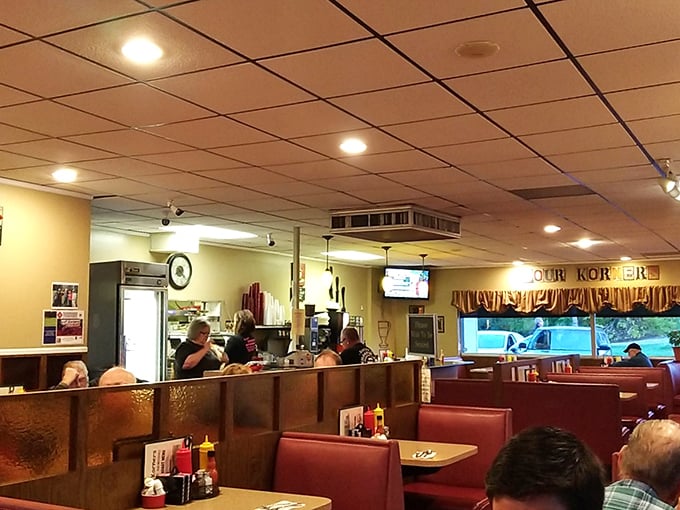 Classic red booths and wood paneling create that time-capsule diner atmosphere where conversations flow as freely as the coffee. Nostalgia never tasted so good. 