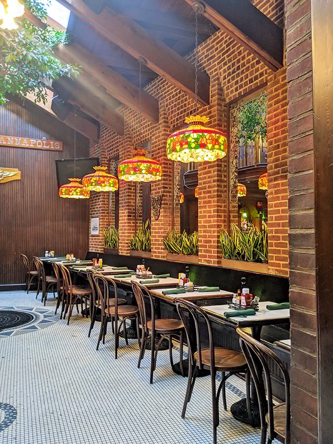 Tiffany-style lamps cast a warm glow over exposed brick walls, creating that perfect "I've discovered somewhere special" feeling that keeps locals coming back.