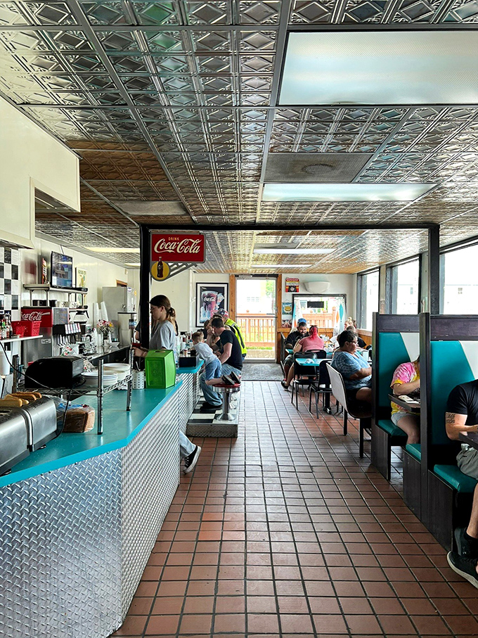 Step inside to classic diner perfection: pressed tin ceilings, turquoise booths, and the comforting clatter of plates that signals breakfast bliss is imminent.