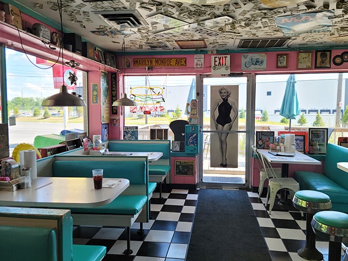 Step inside and the nostalgia hits harder than Elvis's hips. Album covers blanket the ceiling while Marilyn Monroe stands guard at the door, welcoming you to breakfast paradise.