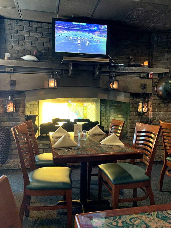 Where rustic meets delicious &ndash; the stone fireplace creates a cozy lodge atmosphere that says "stay awhile" as sports play overhead.