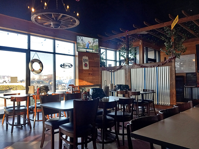 Rustic wooden walls, corrugated metal accents, and wagon wheel lighting create a maritime hideaway where Indiana meets the ocean.