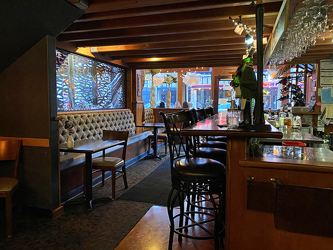 Warm wood tones, tufted seating, and paper lanterns create that perfect "where everybody knows your name" ambiance you've been searching for.