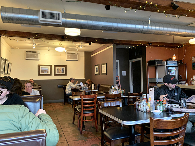 Exposed ductwork, string lights, and wooden tables create that perfect Portland vibe—industrial enough to be cool, cozy enough to linger over that third coffee.