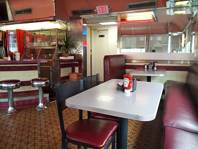 The quintessential American diner experience: burgundy vinyl booths, chrome accents, and the promise of breakfast served all day. Some traditions deserve preservation. 