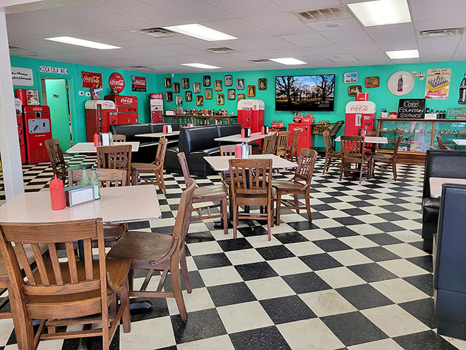 Step into a time machine with this turquoise-walled, black-and-white checkered floor wonderland. Coca-Cola memorabilia isn't just decoration—it's a lifestyle.