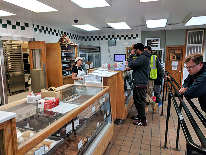 Where donut dreams come true! The vintage checkered tile border and wood-framed display cases transport you to a simpler, sweeter time.