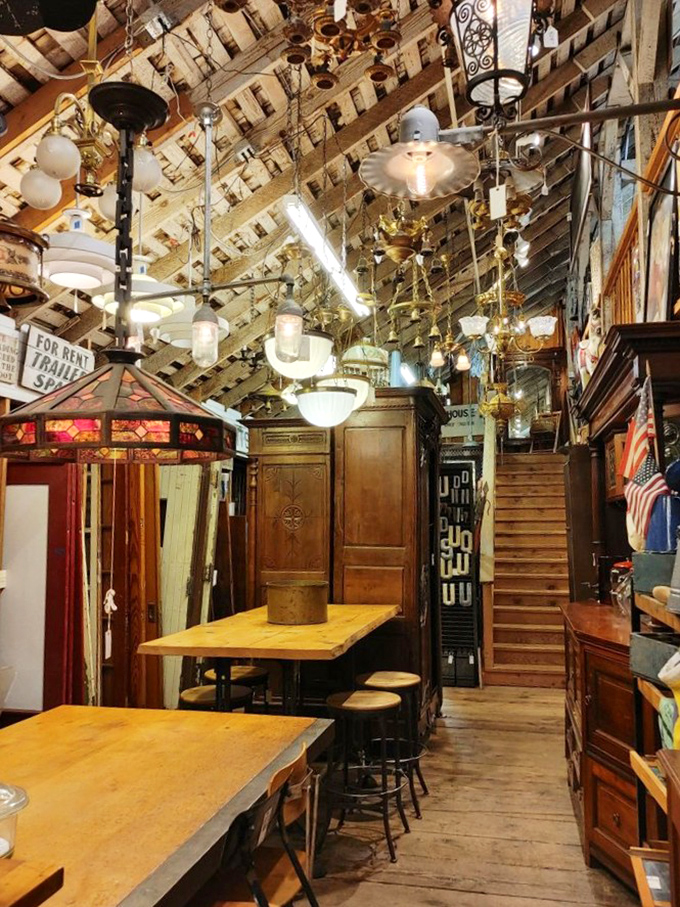 Look up! The ceiling alone is worth the trip&mdash;a constellation of vintage lighting fixtures dangling like historical stars above wooden tables and antique doors.