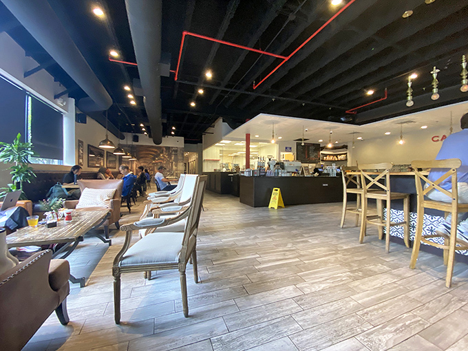 Inside, modern meets classic French charm with wooden floors, comfy seating, and that irresistible promise of carbohydrate happiness.