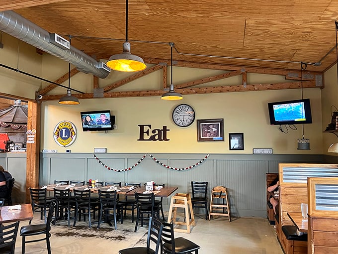 Simple wooden beams, exposed ductwork, and that straightforward "Eat" sign tell you everything you need to know. This place isn't trying to impress you with decor&mdash;they're saving that energy for the food.