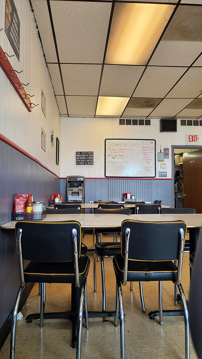 Vinyl chairs, drop ceiling tiles, and an ATM that reminds you this is cash-only territory. This isn't retro by design&mdash;it's authentic by persistence.
