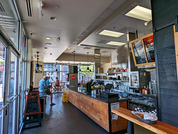 The interior strikes that perfect Portland balance: industrial-chic meets warm wood tones, creating a space where both hipsters and their parents feel equally at home.