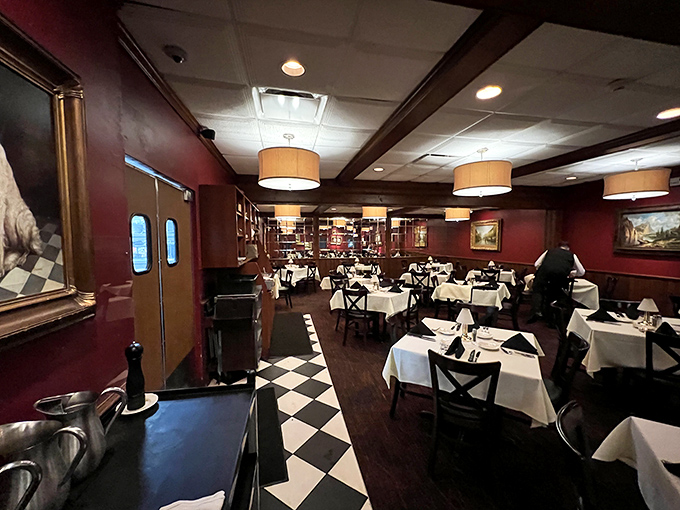 Step inside to burgundy walls, checkered floors, and white tablecloths that whisper, "Your diet ends here, but the memory will last forever."