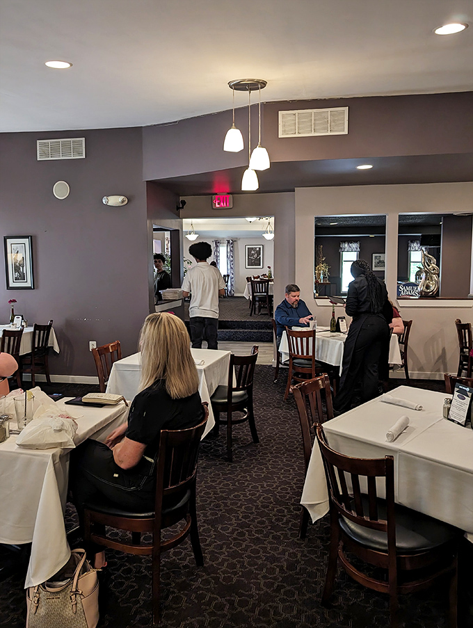 White tablecloths meet unpretentious comfort in a dining room where conversations flow as smoothly as the house wine.