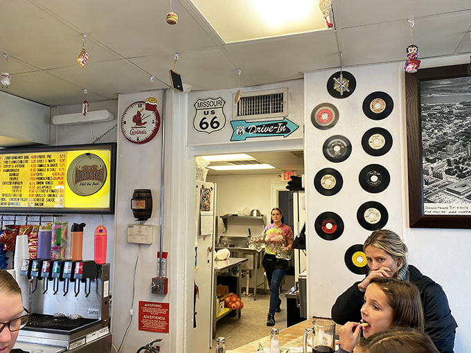 Inside, vinyl records and Route 66 memorabilia transform a simple counter into a museum of Americana where burgers are the exhibits and you're invited to interact.