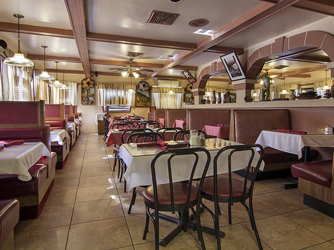 Red vinyl booths and wooden chairs create that perfect "abuela's dining room" vibe—where conversations flow as freely as the salsa.