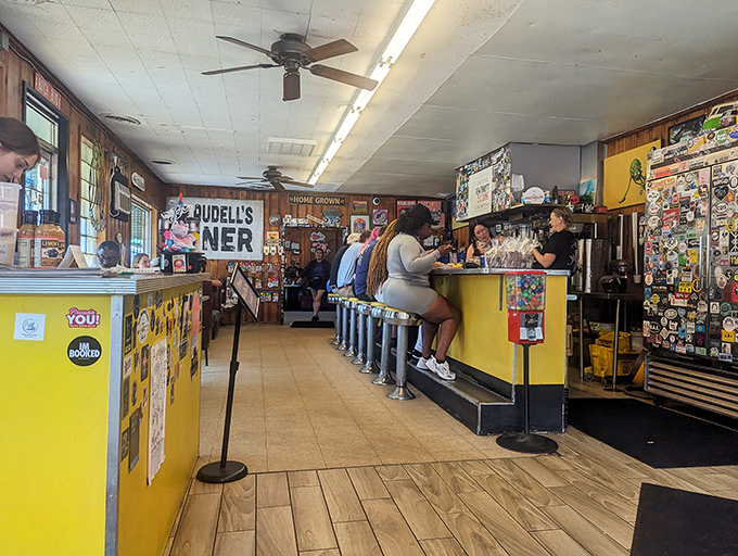 A yellow counter with chrome-trimmed stools invites you into a time warp where conversations flow as freely as the coffee.