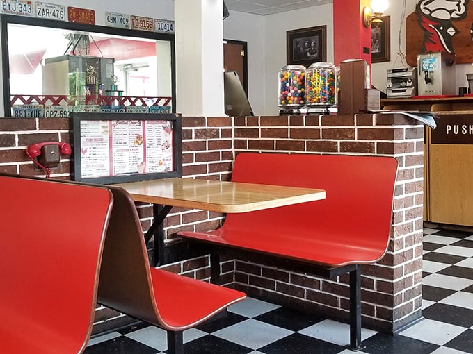 These classic red booths aren't just seating&mdash;they're time machines to when conversations flowed freely and smartphones were science fiction.